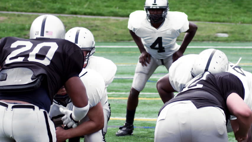 Close Up Of A Football Running Back Getting Tackled By Two Defenders ...
