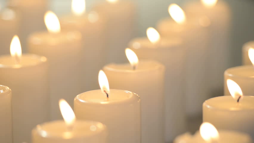 Dolly Shot Of White Candles Burning With Soft Candle Light. Front ...