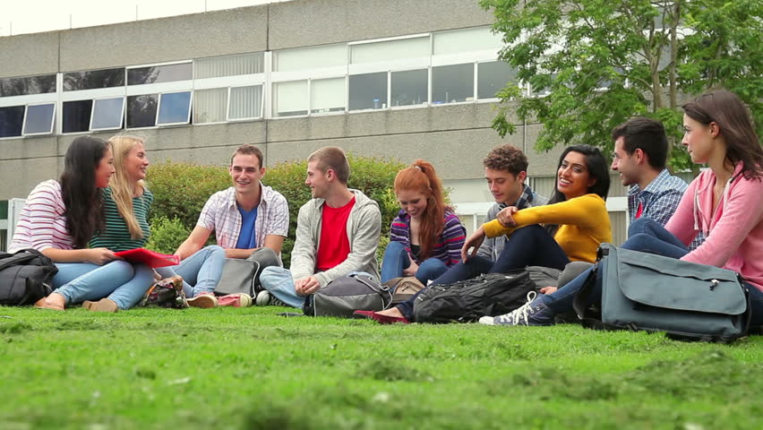 Stock video of happy students sitting on the grass | 5276402 | Shutterstock