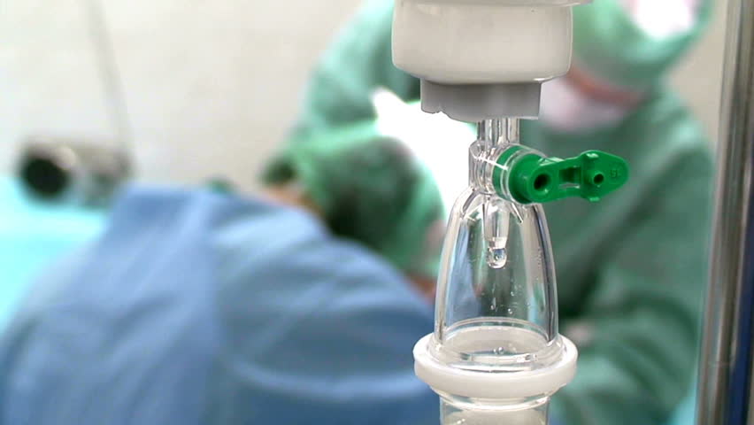 Adjusting Medical IV Drop Rate (HD). Nurse Controlling Intravenous Drip ...