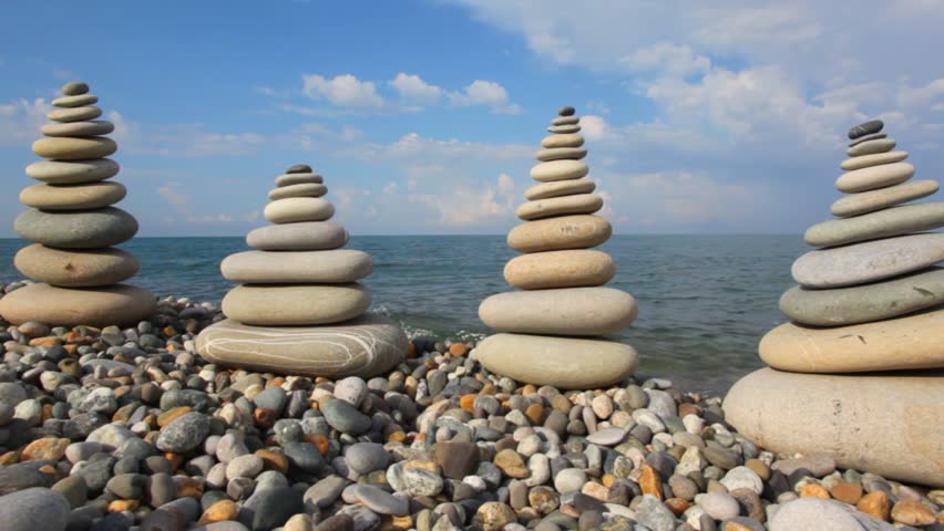Pebble Stack On The Stone Seashore, Sea In Background Stock Footage ...
