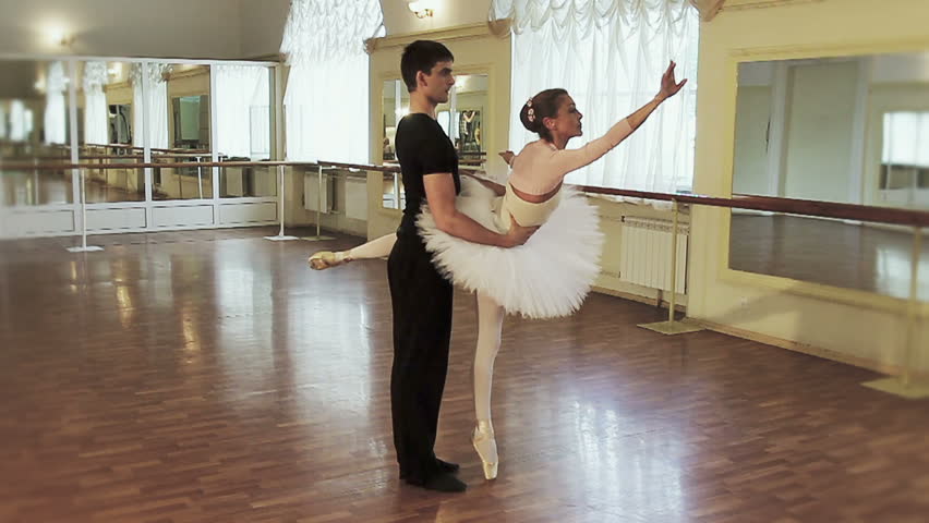 Male And Female Dancers Practicing Ballet Lifts In The Studio Stock ...