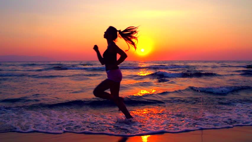 Beauty Runner Woman Running Over Sunset. Young Woman Jogging Along The ...