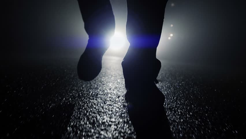 Camera Following Feet Walking Towards Car Light Beams In Dark Night ...