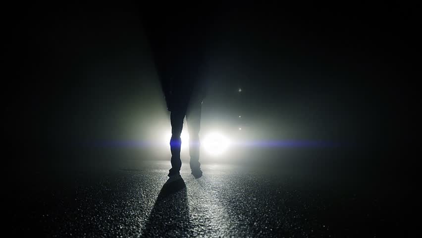 Camera Following Walking Feet Into Light Beams At Night. Mystery Spooky ...