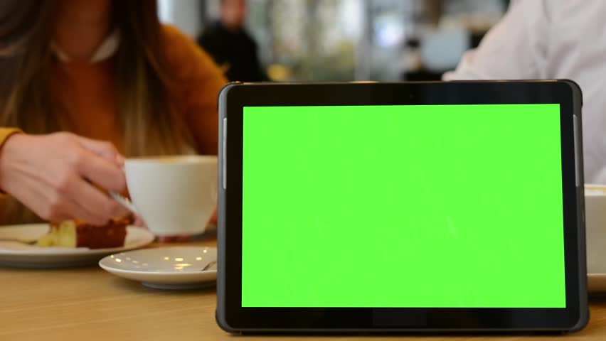 Female Using Tablet Phone In Cafeteria - Green Screen - Chroma Key ...