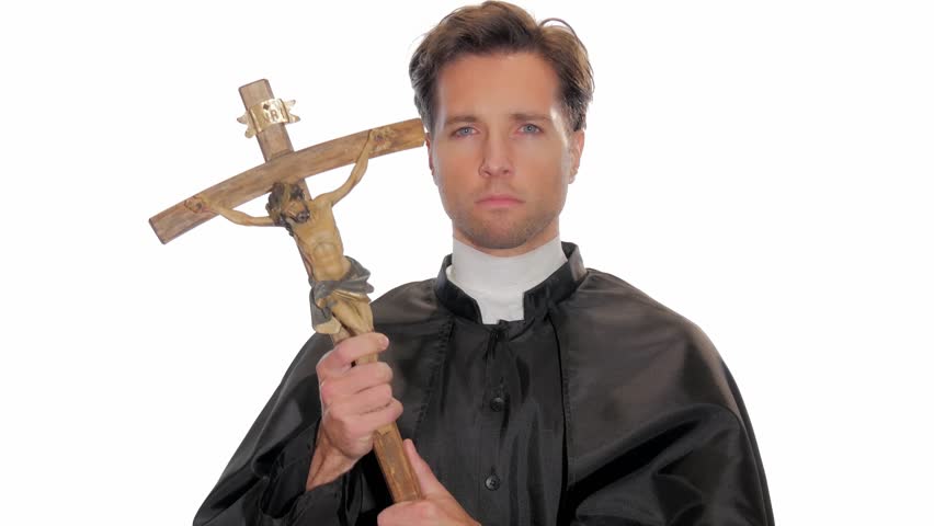 Stock video of proud young priest holding a crucifix | 8478112 ...