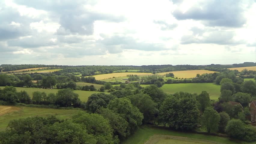 Stunning Aerial Shot Over Lush Green Fields And Meadows In The English ...