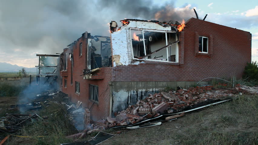 Fireman Working On A House Fire After Dark At Night, Pushing Burning ...