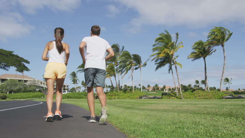 Running Sport People In City Park. Happy Young Couple Living An Active ...