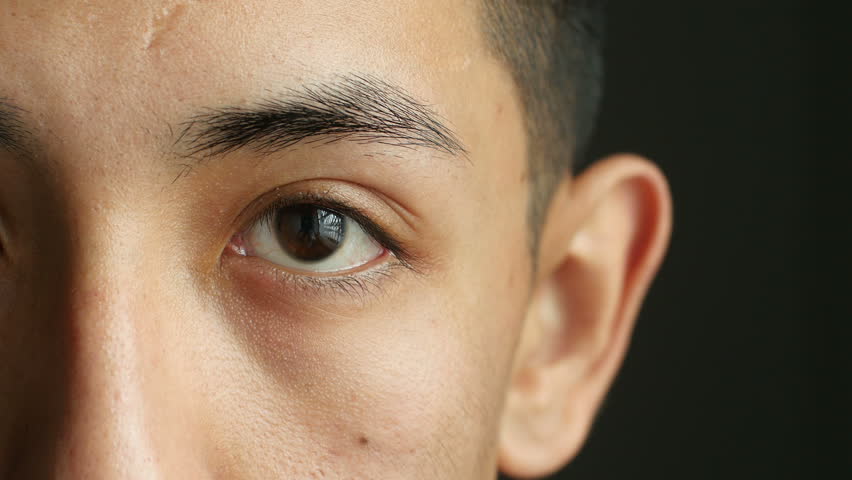 4K Close Up Of One Eye Of A Young Child Looking Straight To Camera And ...